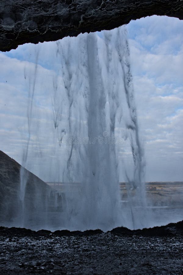 Cave behind waterfall stock photo. Image of blue, water - 70638268