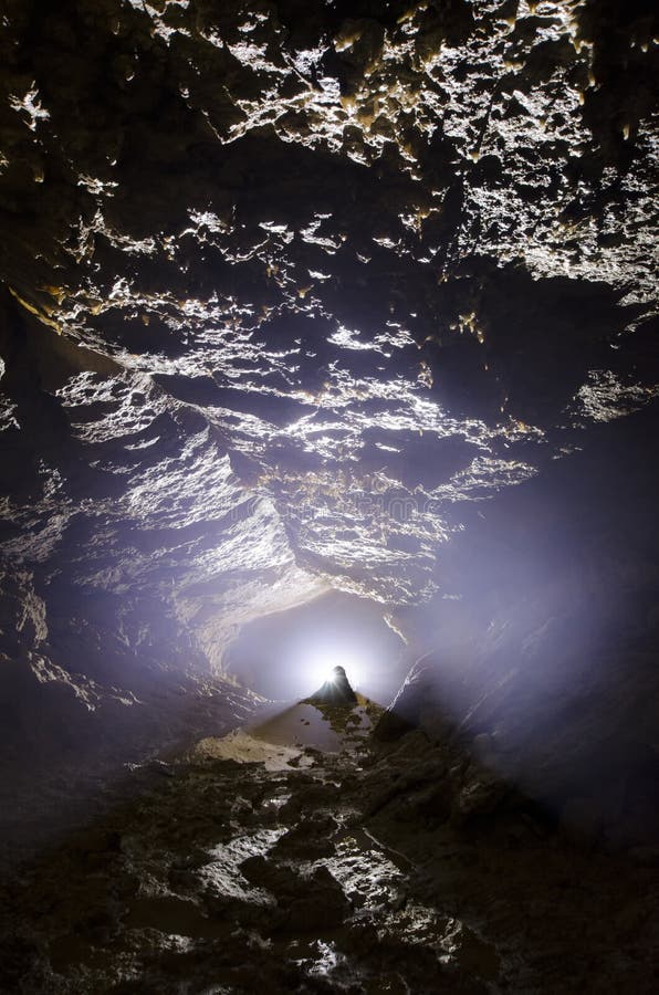 Narrow Cave Passage with a Cave Explorer Stock Photo - Image of ...