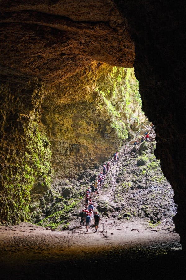 Cave Explorers Ascend Natural Stairs, Helmets and Gear in Tow, Captured ...