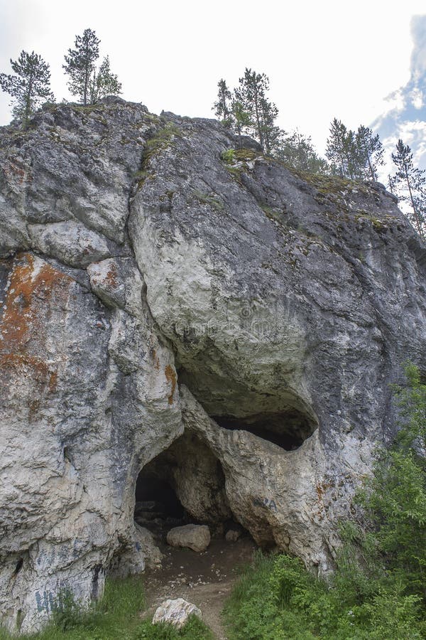Cave in the Rock Coming Out of the Ground Stock Photo - Image of small ...