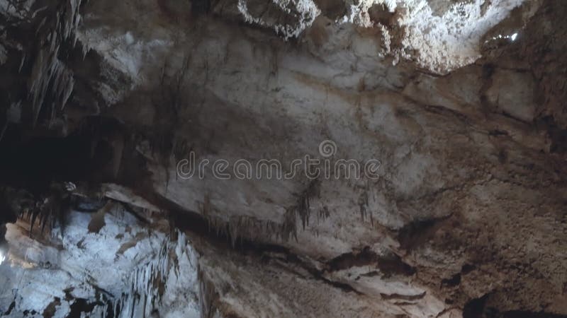 A Cave with Many Stalactites Hanging from the Ceiling. Stock Video ...