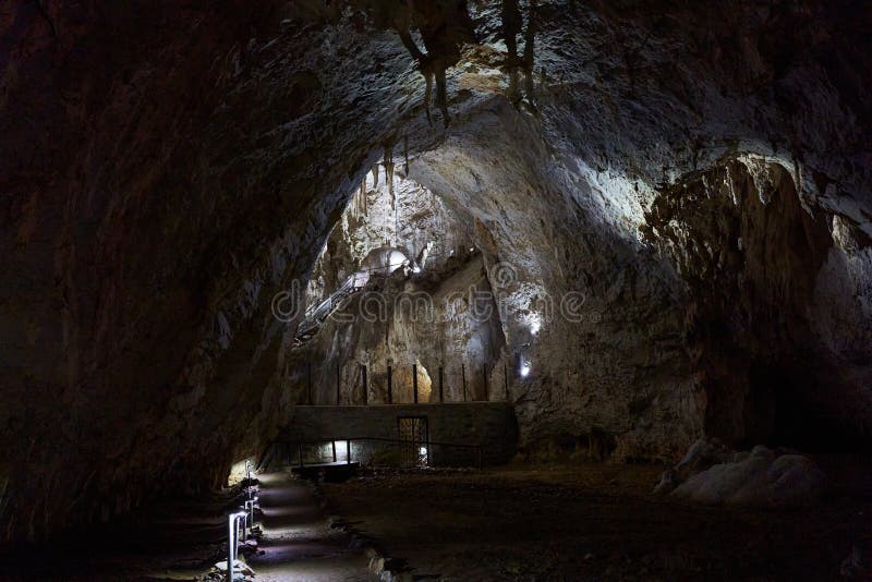 Cave in the mountains stock photo. Image of darkness - 258982338