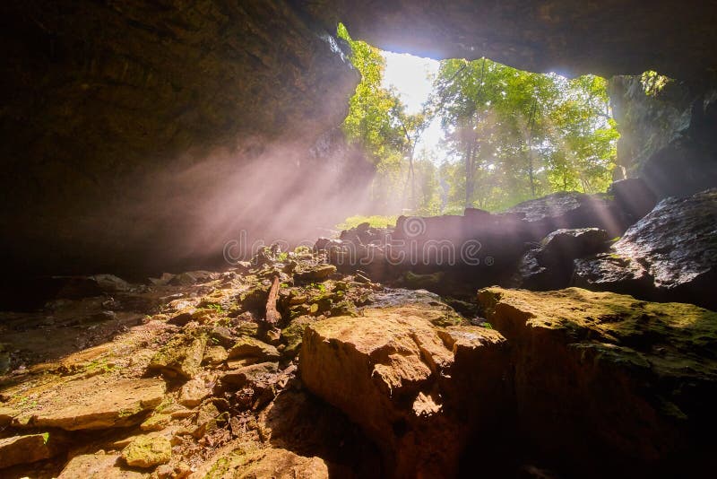 Beams of Light Shining into Cave Opening Stock Photo - Image of stone ...