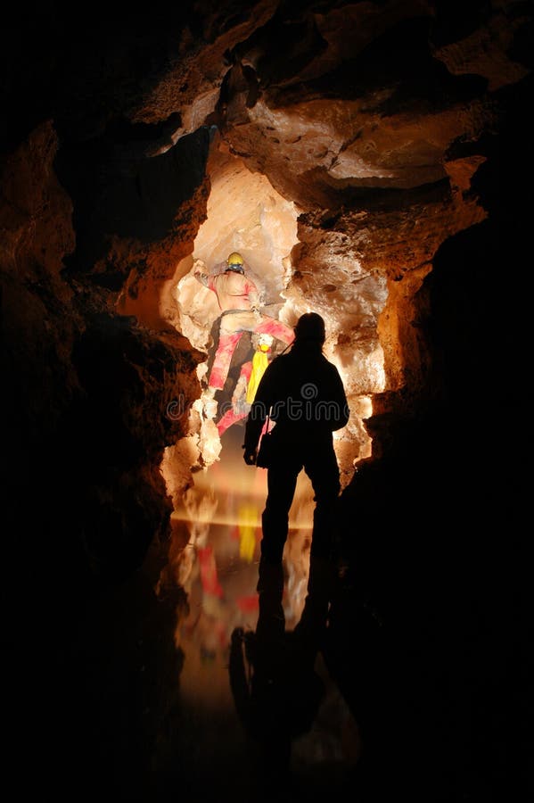 Cave explorer in action stock photo. Image of meander - 17536716