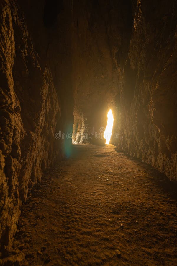 A Cave with a Small Opening in the Wall. the Light Shining through the ...