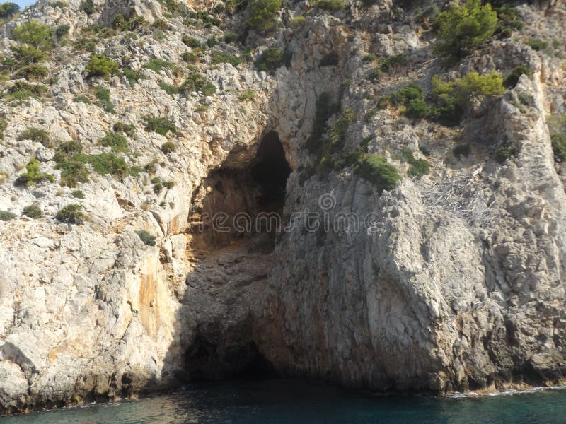 Cave stock photo. Image of spain, grass, bushes, cave - 137334134