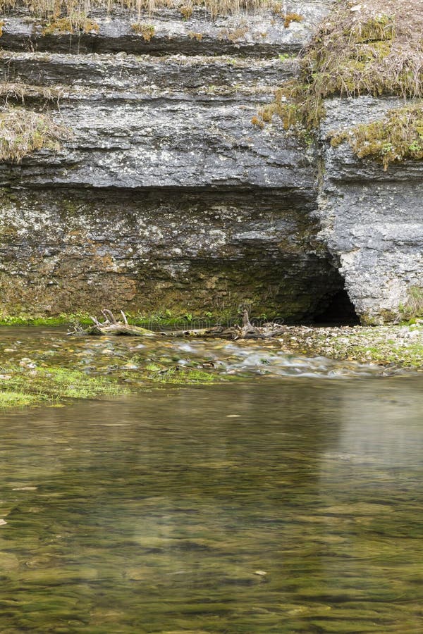 Cave in Spring stock image. Image of beauty, water, stone - 54478427