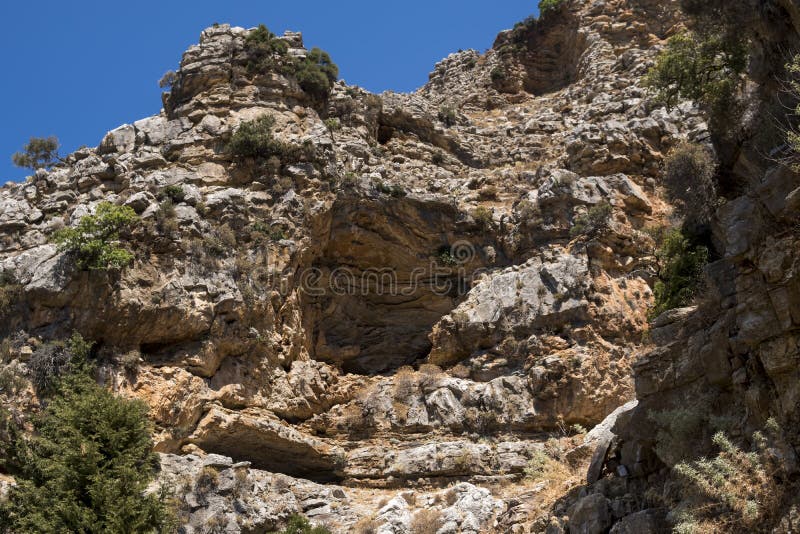 Cave on Steep Slope of a Mountains at Rhodes Island Stock Image - Image ...