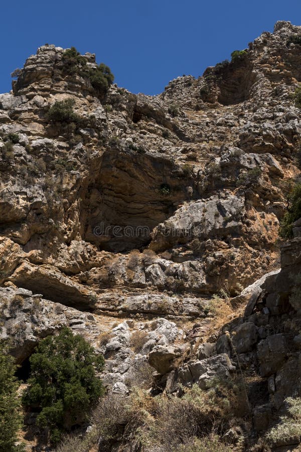 Cave on Steep Slope of a Mountains at Rhodes Island Stock Image - Image ...