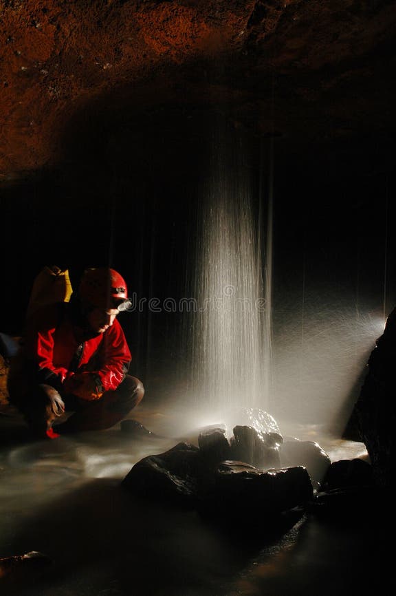 Caver with a Small Waterfall Stock Image - Image of indoor, hall: 21836981