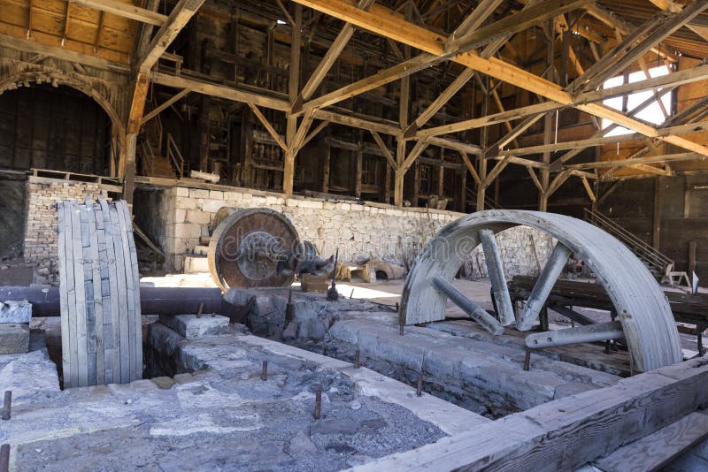 Cavernous Wooden Building with Large Metal Wheels for Ore Processing ...