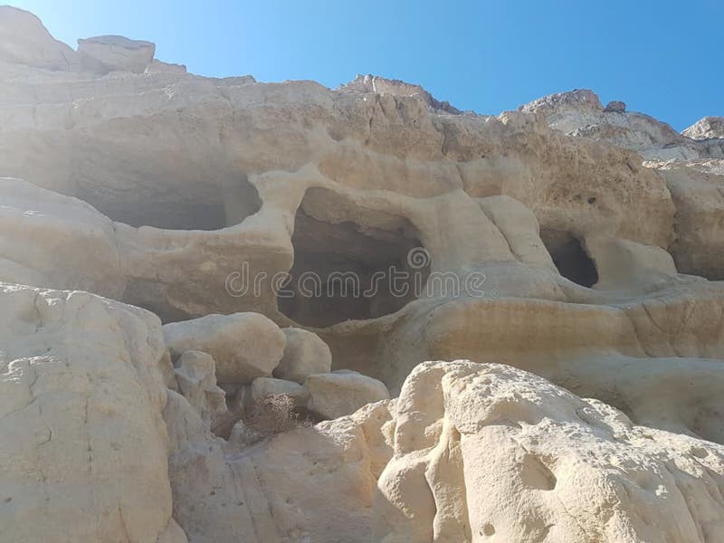 Caves in a Rock Near the Beach Stock Photo - Image of park, valley ...