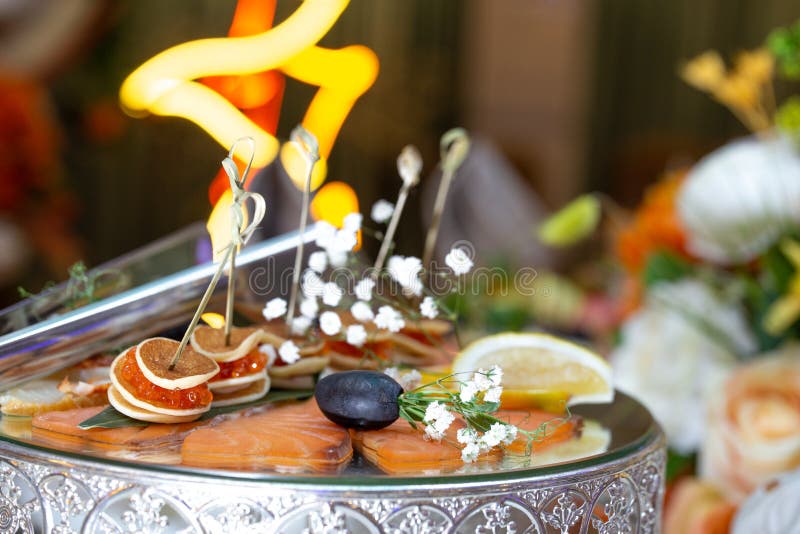 Caviar Canapes and Fish Slices on a Plate on the Buffet Table Stock ...