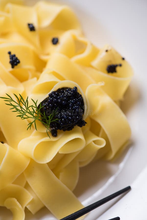 Caviar Pasta Tagliatelle on a White Dish. Stock Image - Image of ...