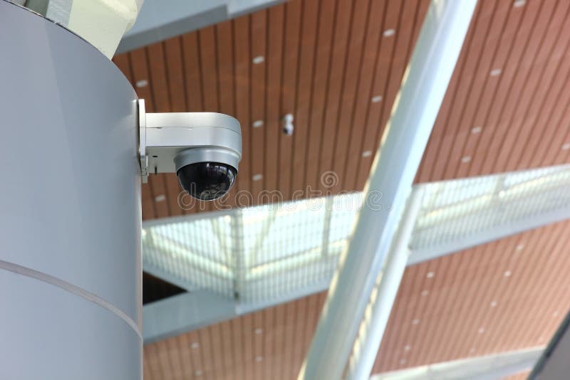 The CCTV Camera Install on Gray Wall Watching Security People and ...