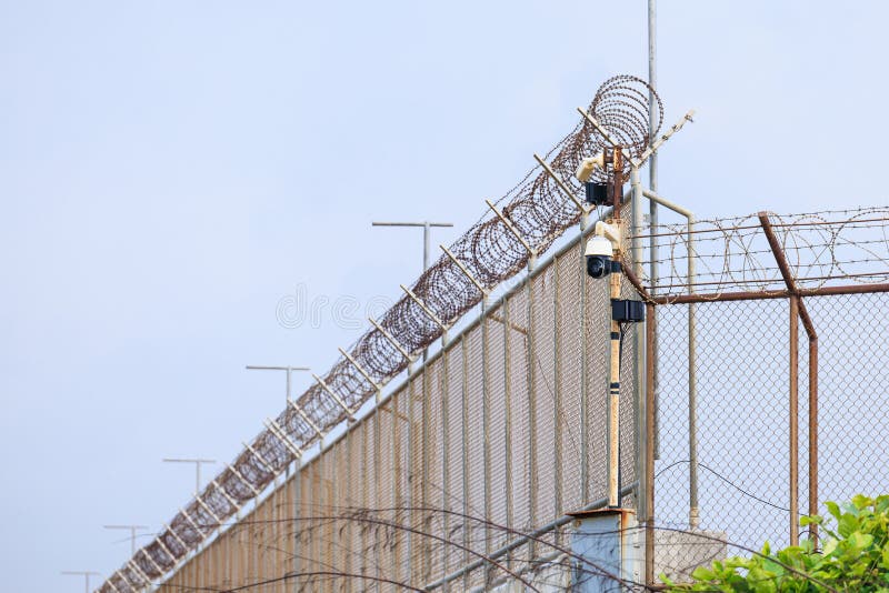 CCTV Camera Installed on the Edge of the Barded Wire Fence Stock Image ...
