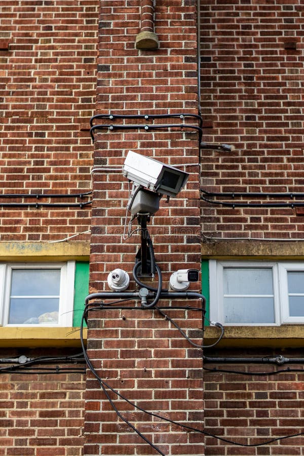 A CCTV Camera on the Side of a Brick Building Stock Image - Image of ...