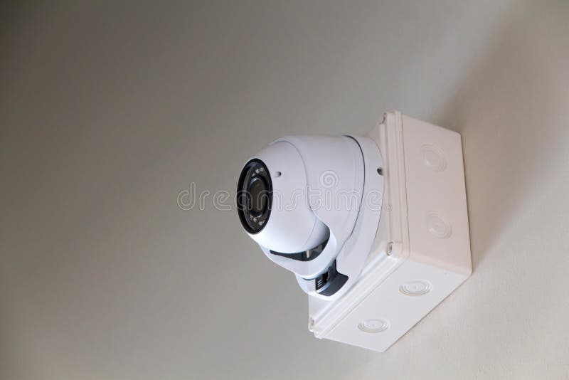 A Cctv Camera on Wall Inside the Building for Watches Down Below ...