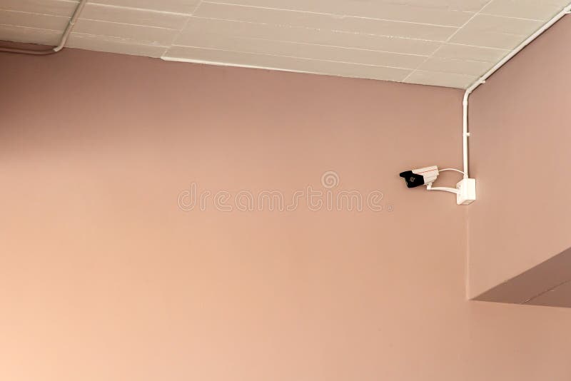 A Cctv Camera on Wall Inside the Building for Watches Down Below ...