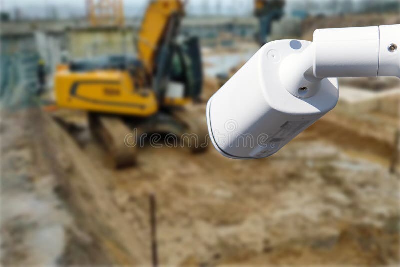 CCTV Camera Watching an Excavator and Workers Working on a Construction ...