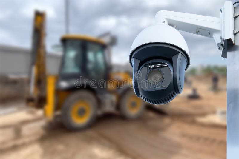 CCTV Camera Watching an Excavator and Workers Working on a Construction ...