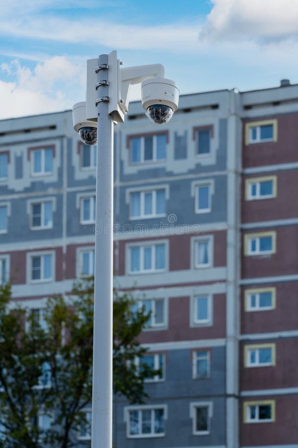 CCTV Cameras on a Pole, the Facade of a Panel Apartment Building in the ...
