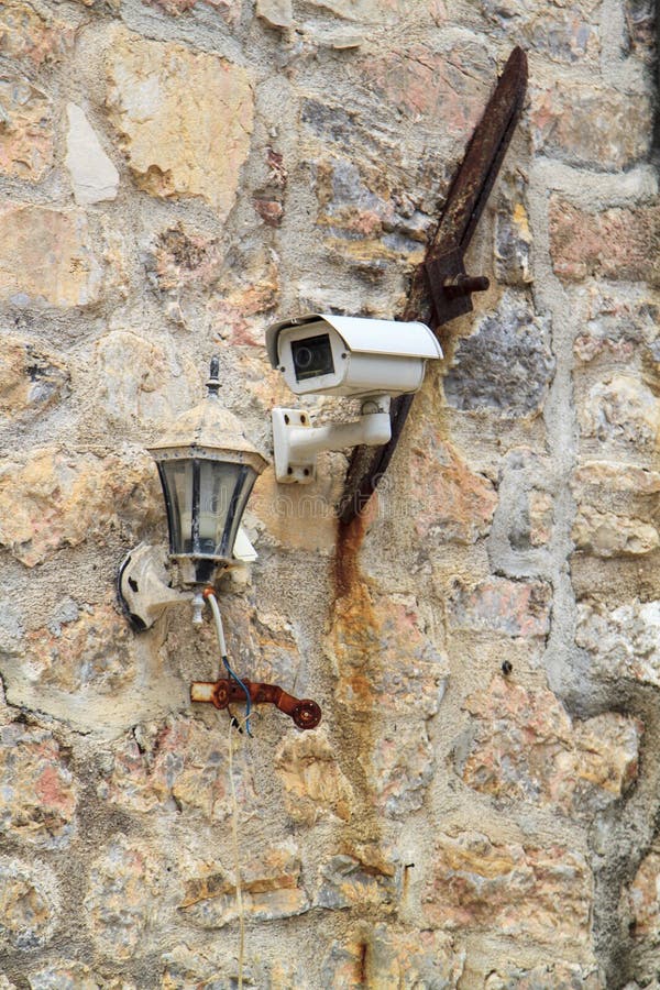CCTV Security Camera on the Ancient Stone Wall Stock Image - Image of ...