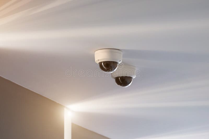 CCTV Security Camera Mounted on a White Ceiling. Stock Image - Image of ...