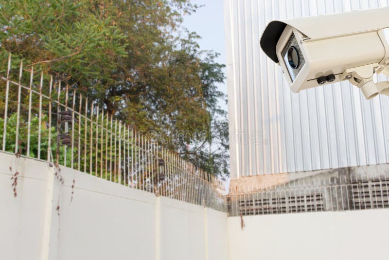 The CCTV Security Camera Operating on Backyard Roofing House Stock ...