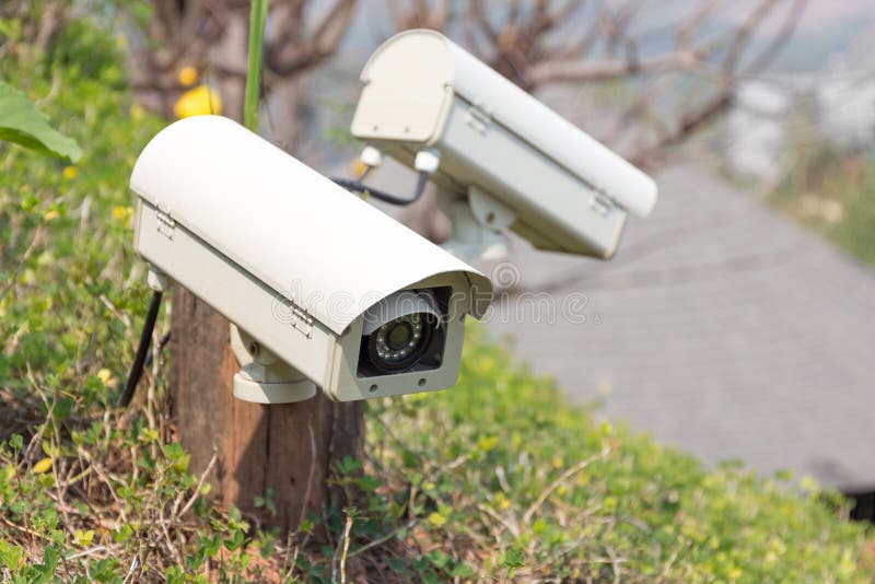 CCTV Security Camera Operating on Ground Lawn Stock Photo - Image of ...