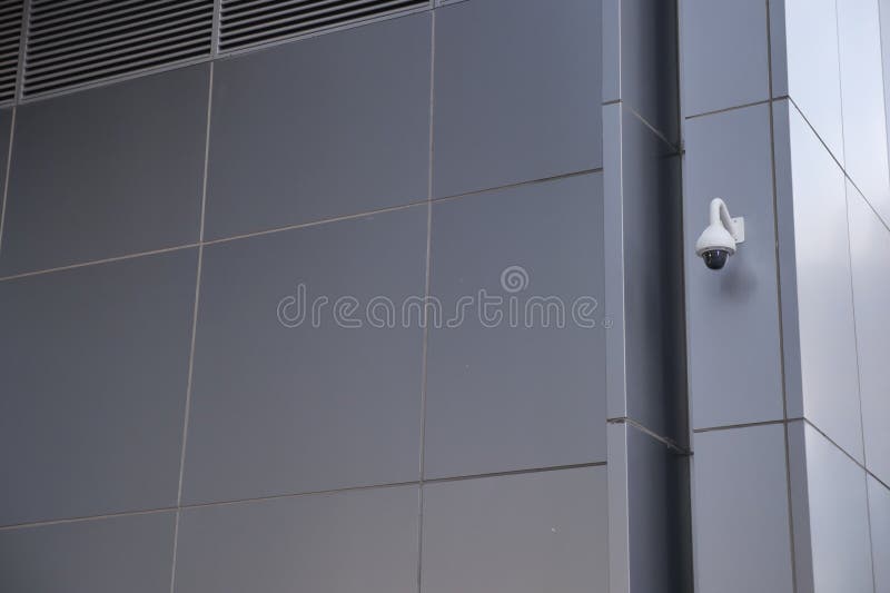 CCTV Security Camera Operating on Wall of a Building Stock Image ...