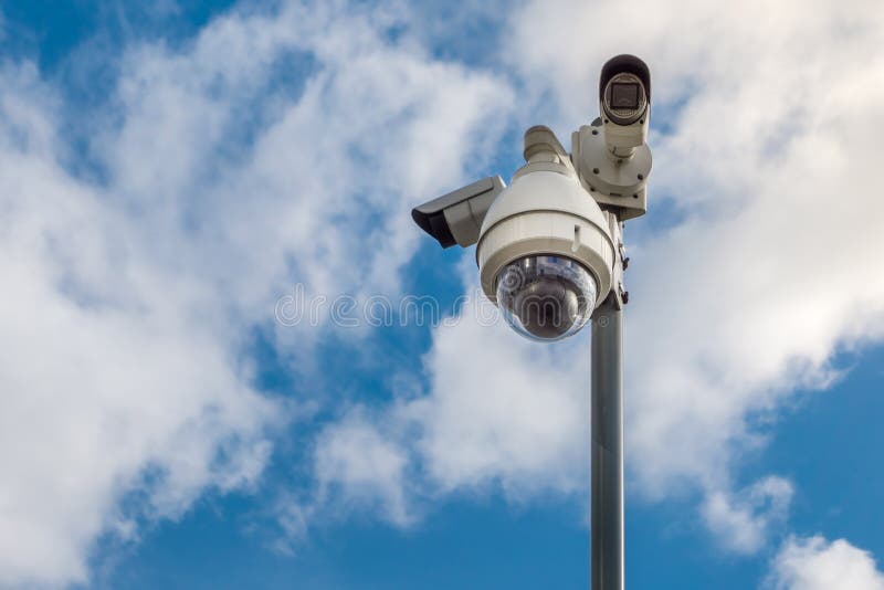 CCTV Security Cameras on Pole on Blue Sky with White Clouds Background ...