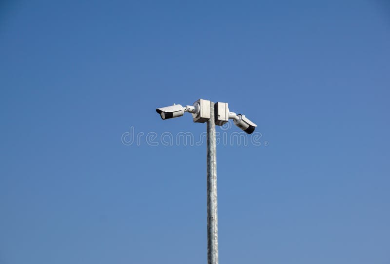 Surveillance Camera on Light Pole in Parking Lot Stock Image - Image of ...