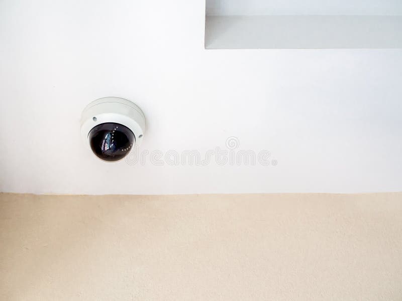 CCTV System Security. Round CCTV Camera on Ceiling in the Corner of the ...