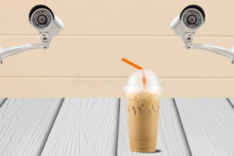 CCTV System Security on Wall with Iced Coffee on Wood Floor Stock Image ...