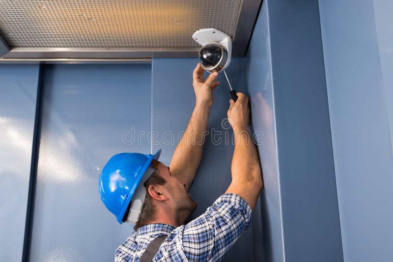Cctv camera technician stock image. Image of belt, cctv - 30284275