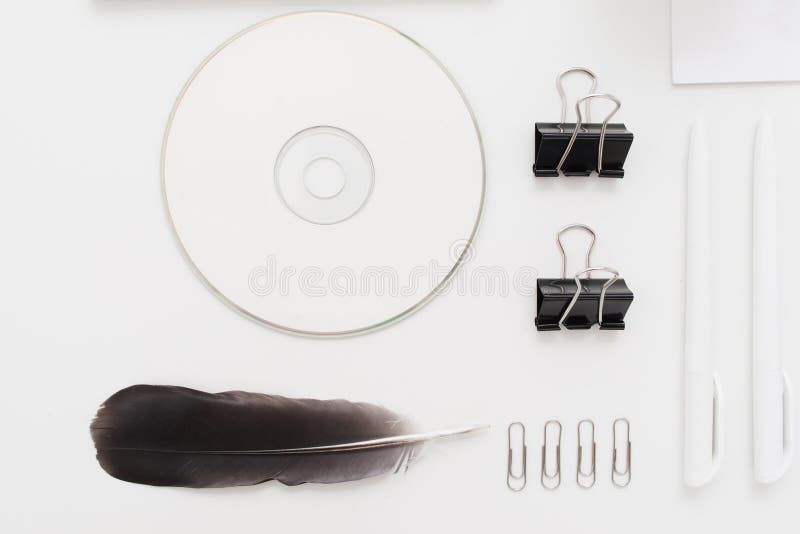 Cd with Clips and Feather on White Flat Lay Stock Image - Image of ...