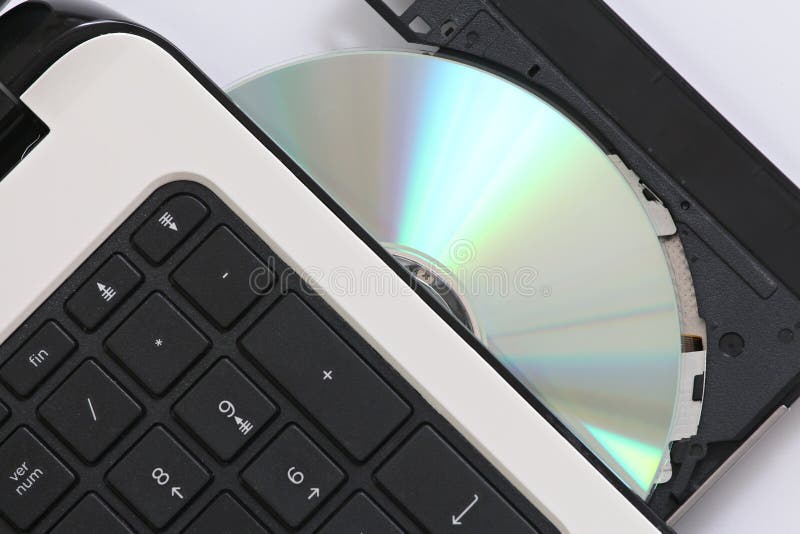 CD into a computer stock image. Image of disk, files - 65632765