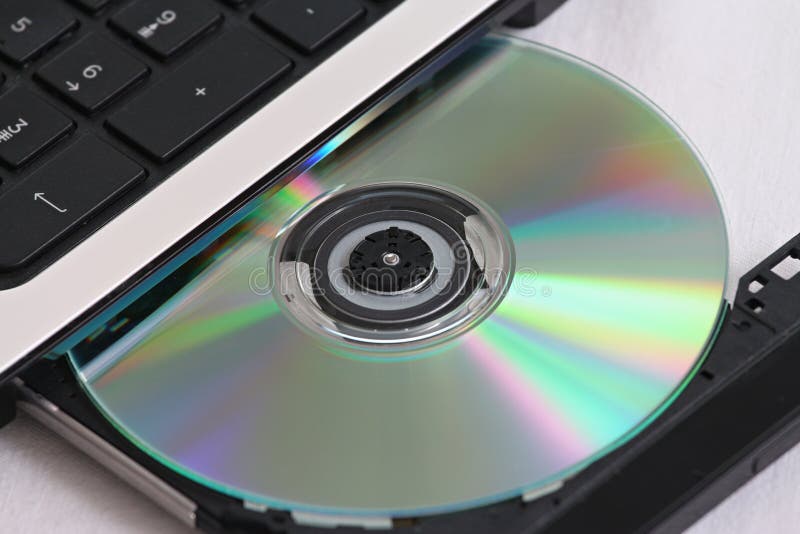 CD into a computer stock photo. Image of read, compact - 65633050