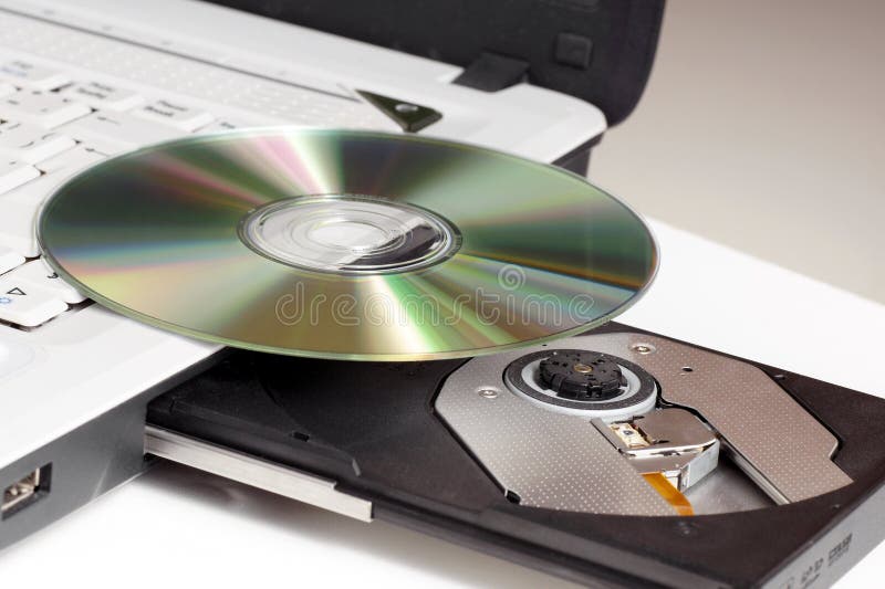 CD/DVD and laptop. stock photo. Image of computer, plastic - 20795926