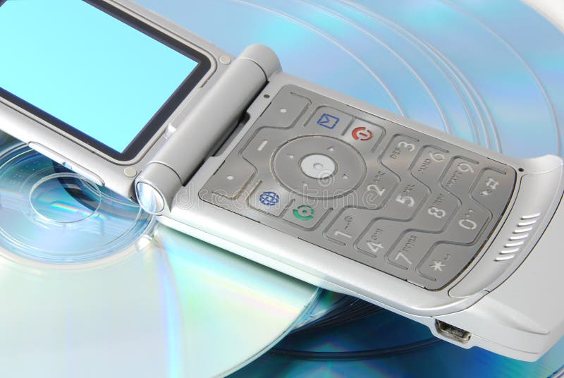 Cd s and a cell phone stock photo. Image of recordable - 1925792