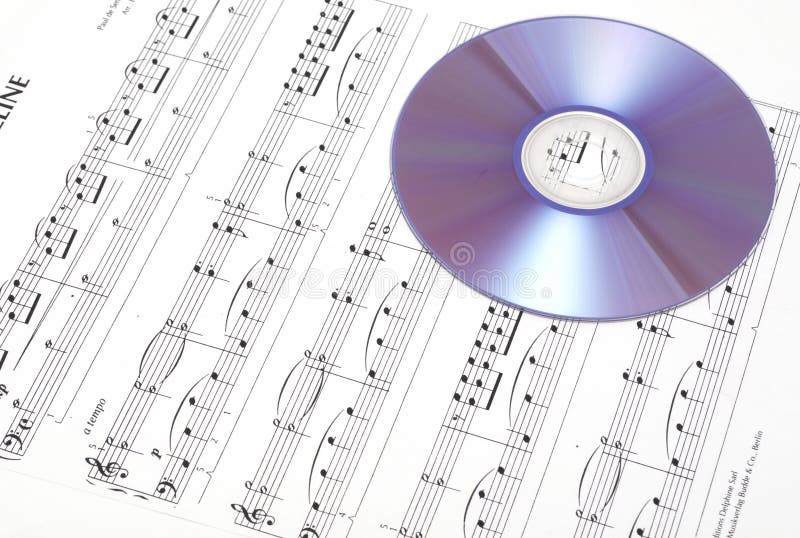 CD on sheet music. stock photo. Image of disk, abstract - 13091856