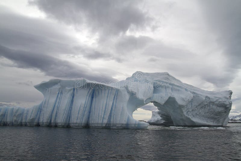 Ceberg with Arch and Gullies on a Cloudy Autumn Stock Image - Image of ...