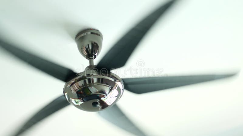 Ceiling Fan Spinning on Studio Blue Background Stock Video - Video of ...