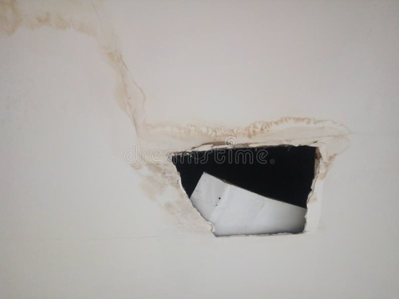 The Ceiling of the Gypsum Ceiling Which is Damaged with Holes Stock ...