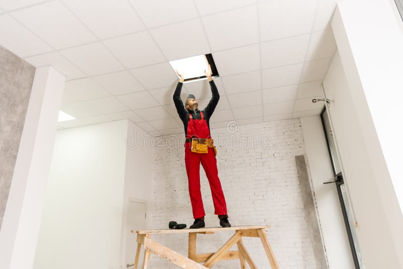 Ceiling Installation with Expert Technicians in the Room that is in the ...