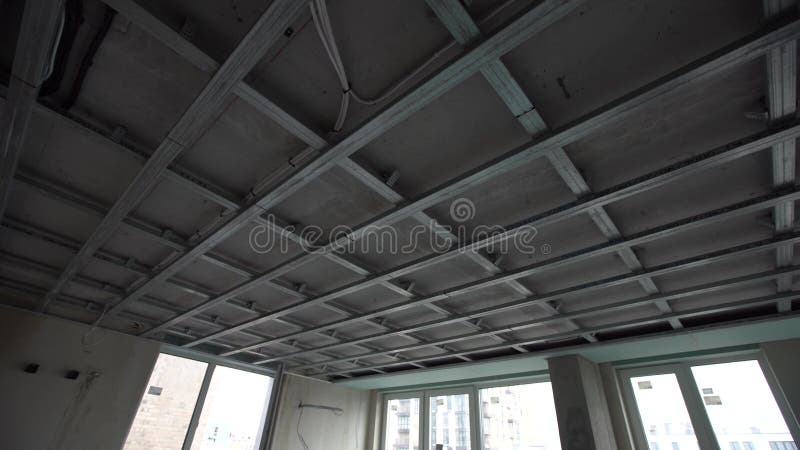 Ceiling Installation with Expert Technicians in the Room that is in the ...