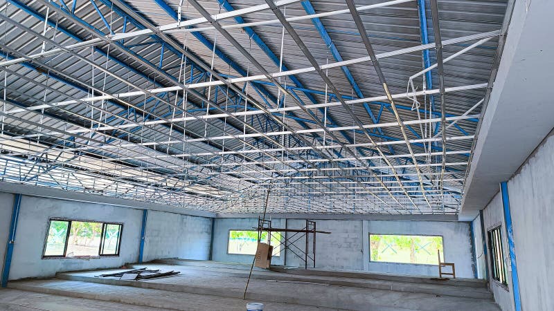 Ceiling Installation with Expert Technicians in the Room that is in the ...