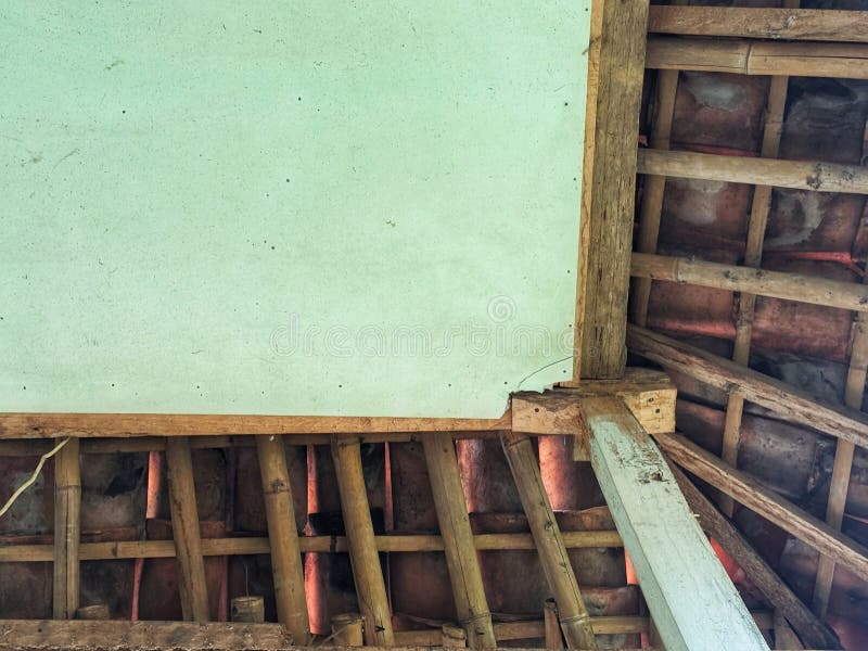 The Ceiling Made of Wood and Bamboo Structure Next To a Green Roof ...