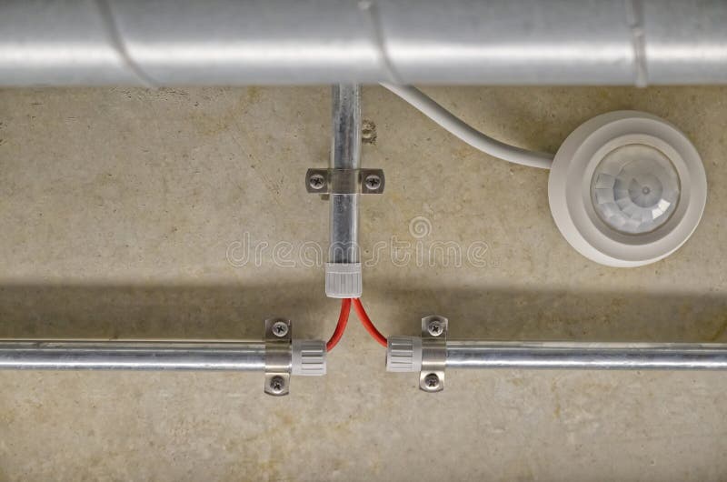 Ceiling-Mounted Motion Sensor with Exposed Wiring Stock Image - Image ...